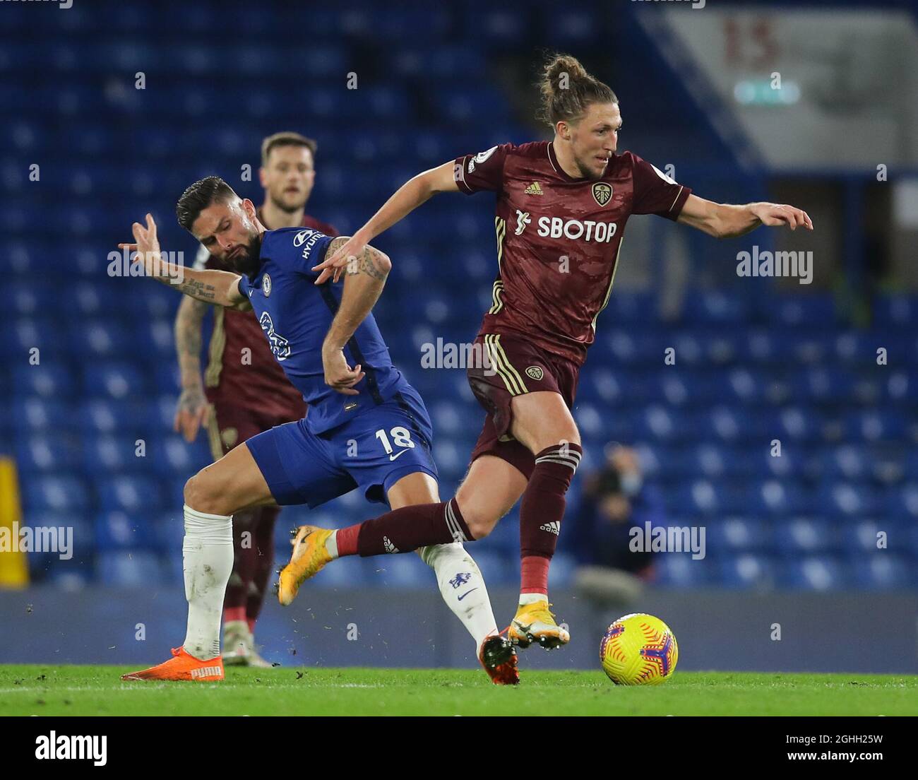 Olivier Giroud of Chelsea tackles Luke Ayling of Leeds United during ...