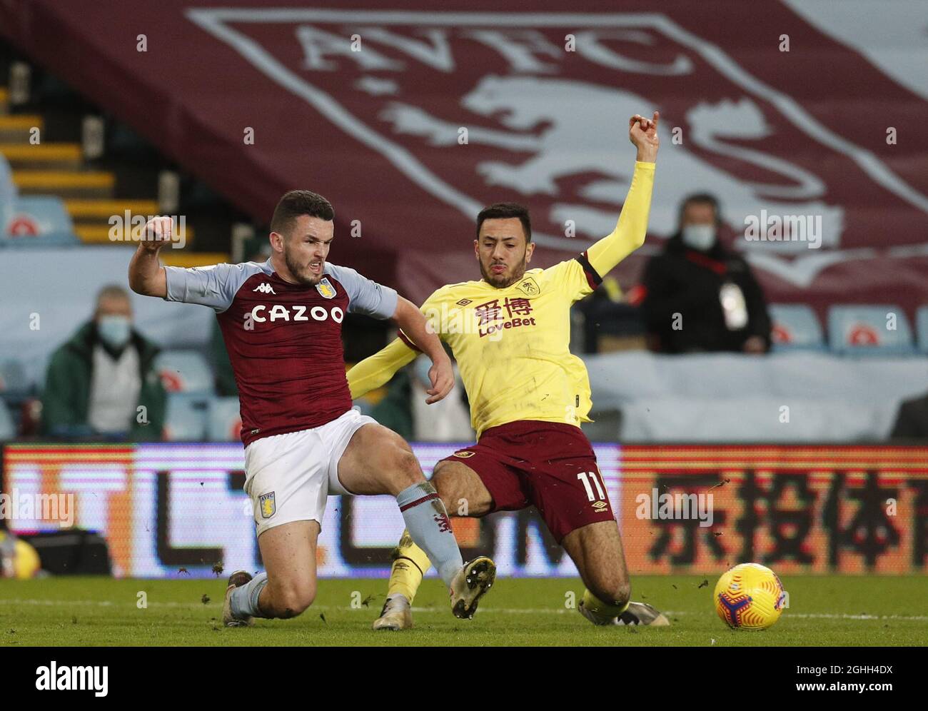 John McGinn of Aston Villa challenges Dwight McNeil of Burnley during ...
