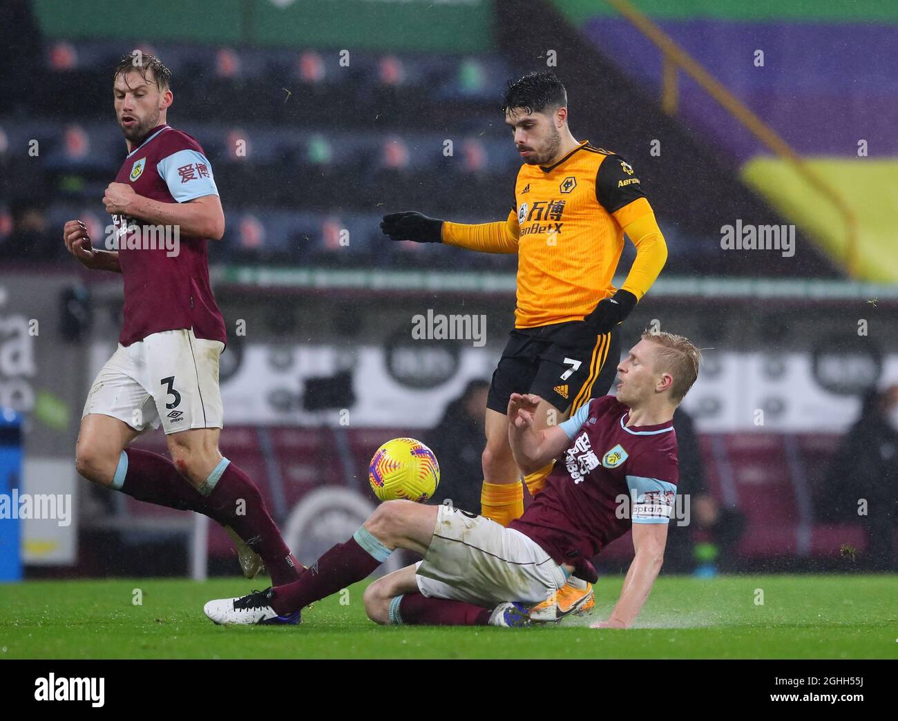 Pedro Neto of Wolverhampton Wanderers tackled by Ben Mee of Burnley ...