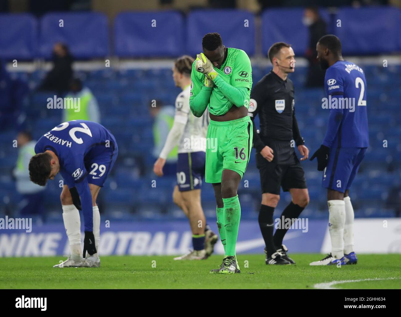 Edouard Mendy of Chelsea wipes his face during the Premier League match ...