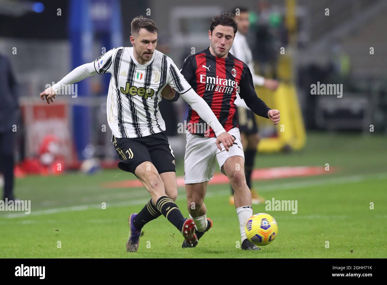 Aaron Ramsey of Juventus plays the ball as Davide Calabria of AC Milan ...