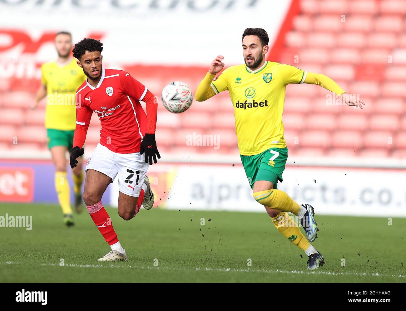 Lukas Rupp of Norwich City in action with Romal Palmer of Barnsley ...
