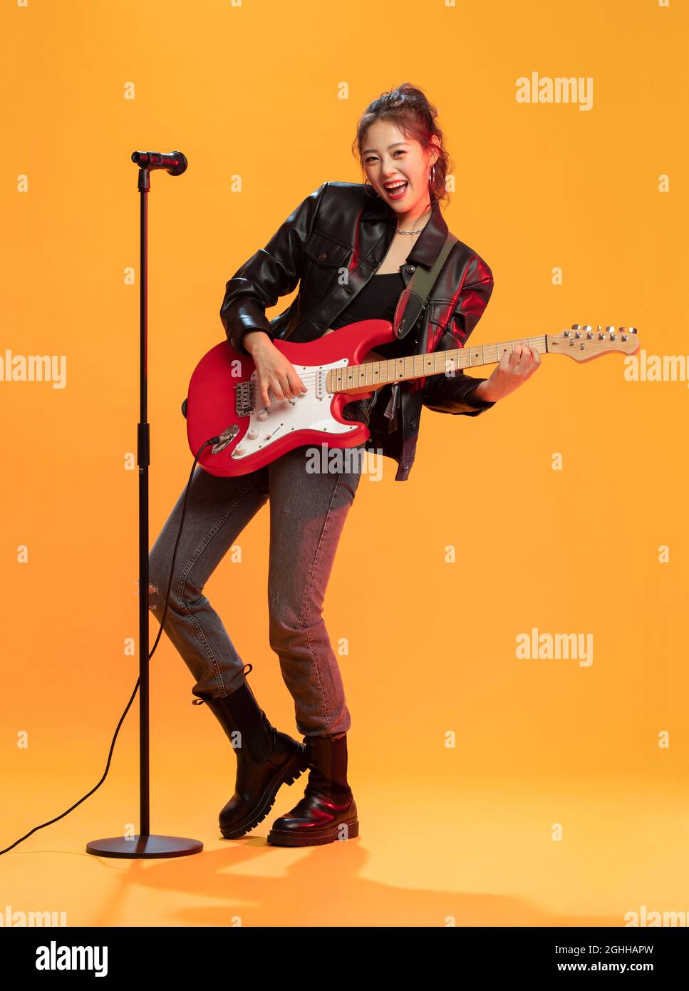 Arts culture and entertainment guitar performance standing music ...