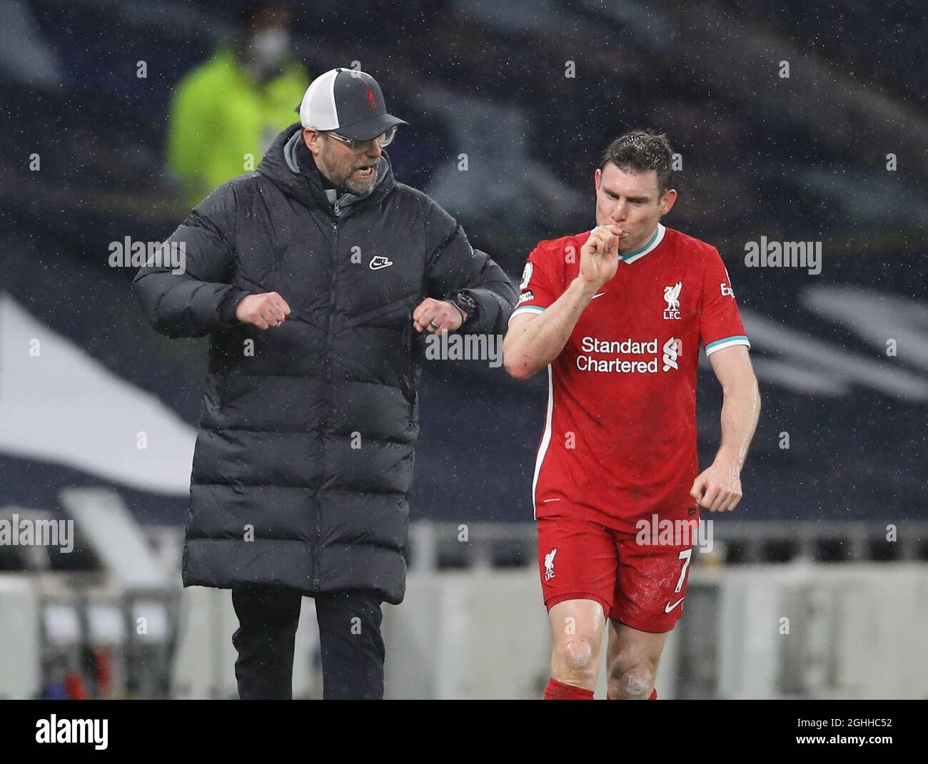 Jurgen Klopp manager of Liverpool encourages James Milner of Liverpool ...