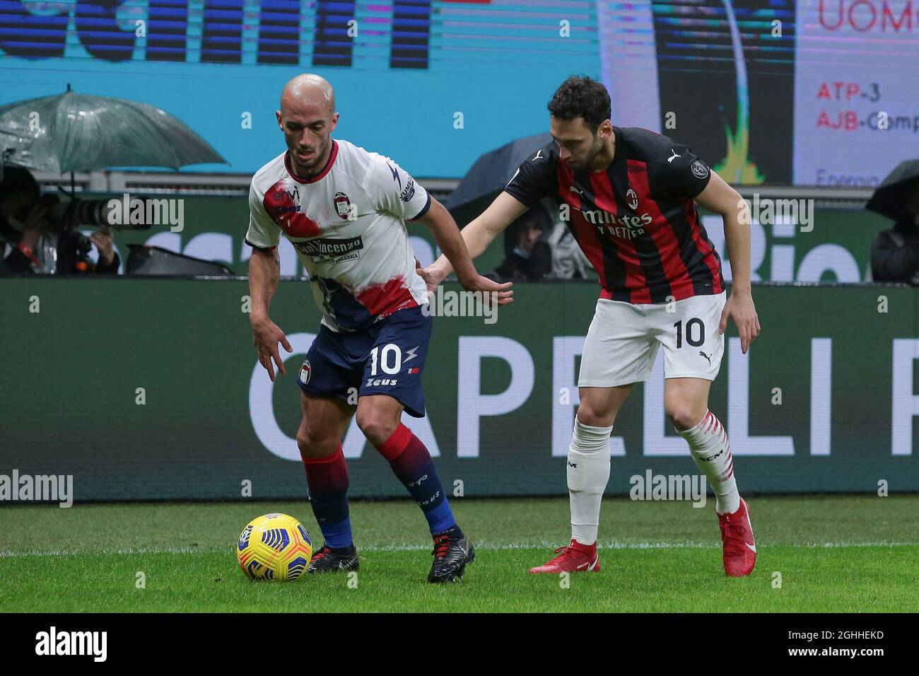 Ahmad Benali of Crotone shields the ball from Davide Calabria of AC ...