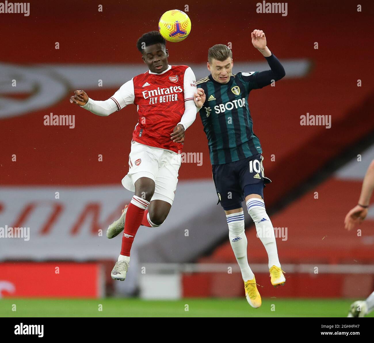 Bukayo Sako of Arsenal challenges Ezgjan Alioski of Leeds United during ...