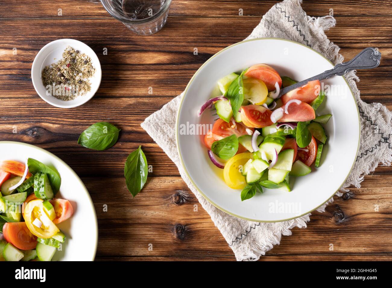Fresh green salad in white bowl on wooden table. Rustic style Stock ...