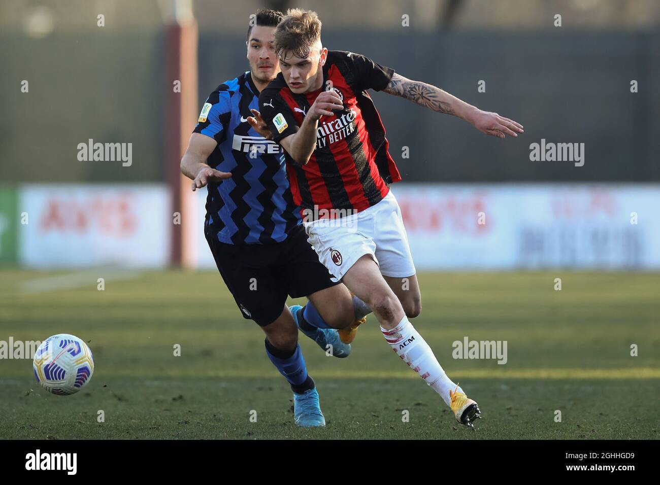 Antonio Mionic of AC Milan takes on Daniel Tonoli of Internazionale ...