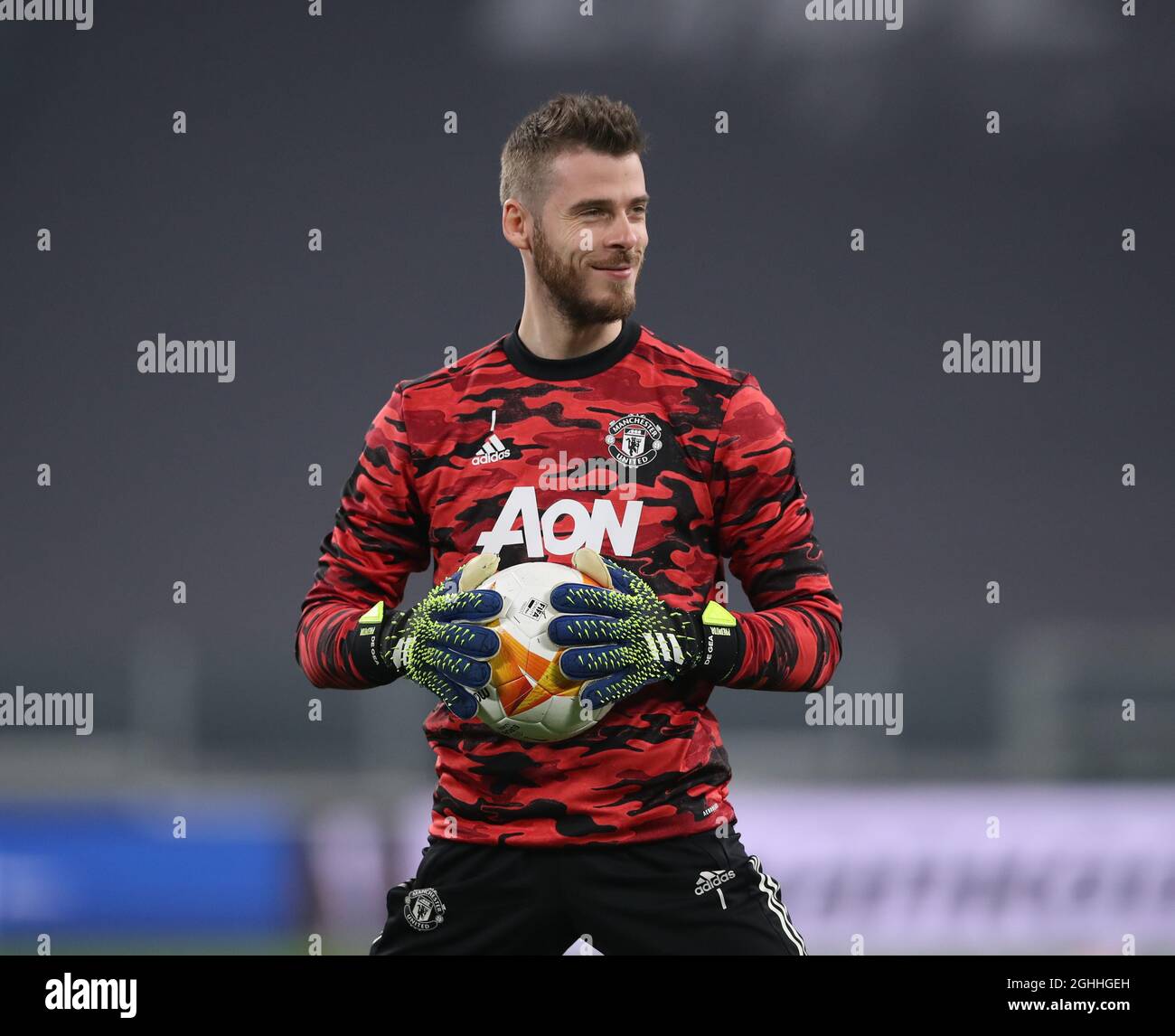David De Gea of Manchester United who starts on the bench smiles during ...