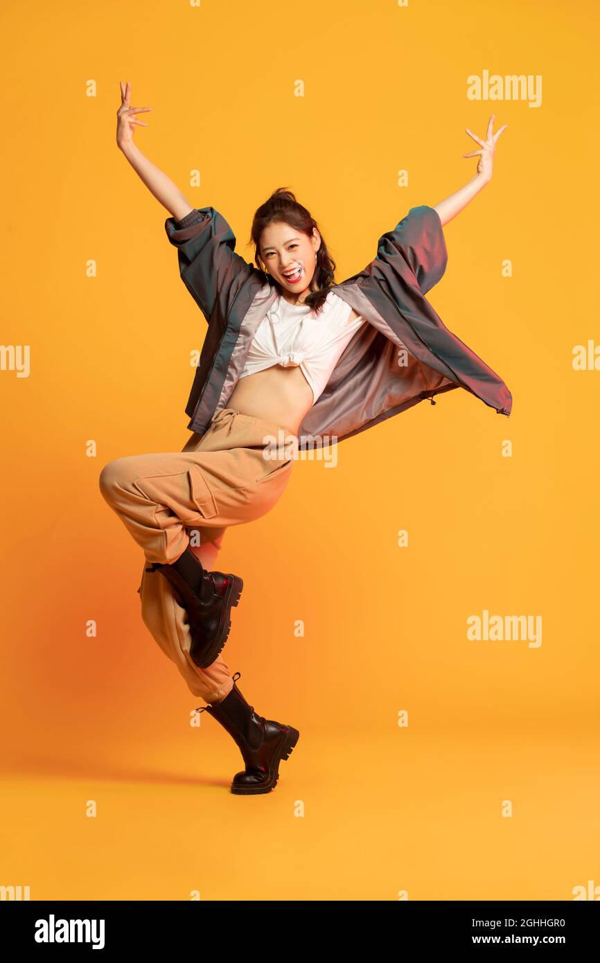 Beautiful young woman dancing over hi-res stock photography and images ...