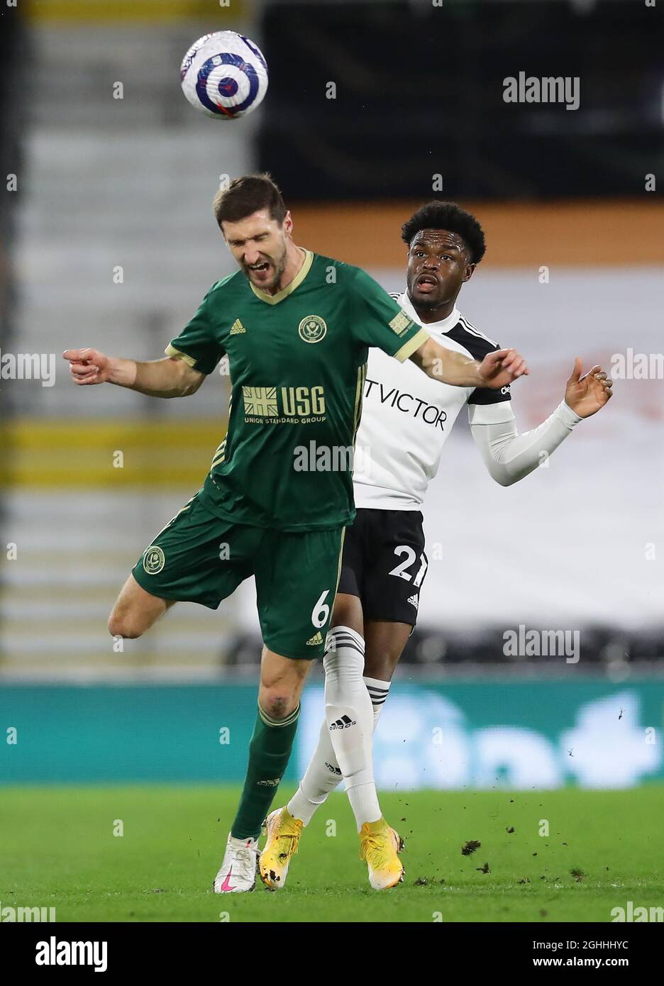 Chris Basham of Sheffield Utd challenged by Josh Maja of Fulham during ...