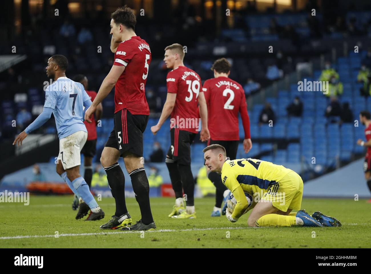 Dean Henderson of Manchester United collects the ball and holds onto it ...