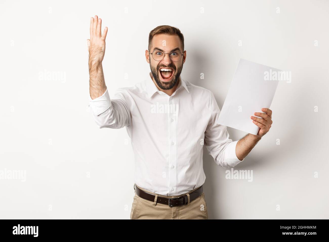 Angry businessman shouting and showing bad report, looking disappointed ...