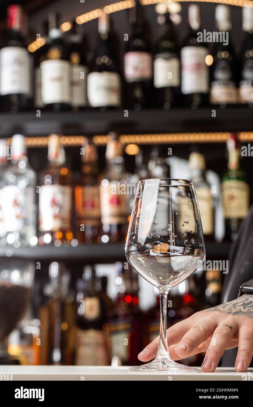Low angle close up perspective of crystal clear wine glass with ...