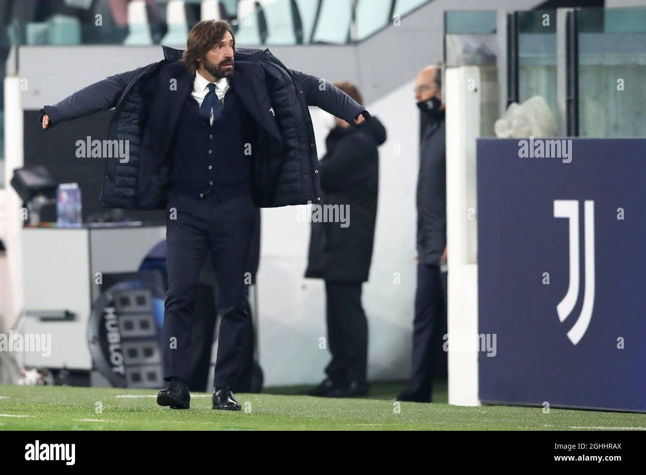 Andrea Pirlo Head coach of Juventus puts on his coat as the temperature ...