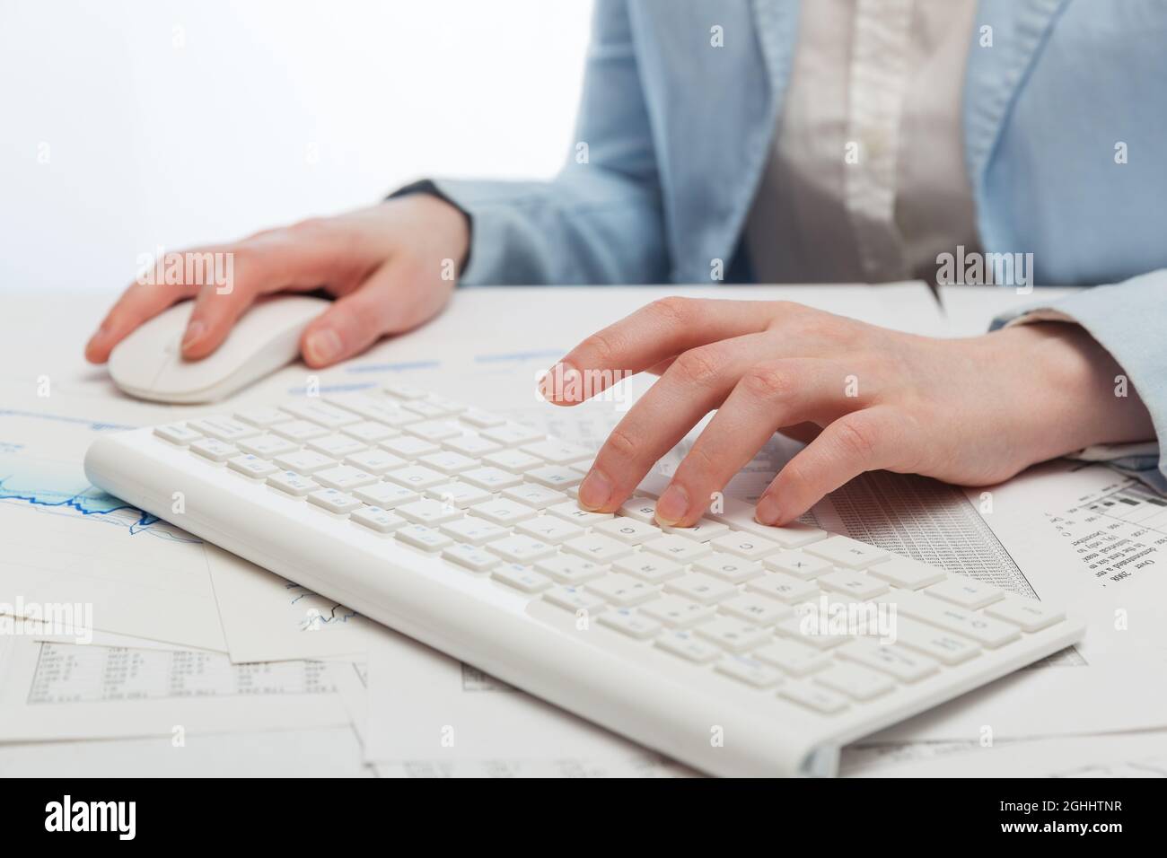 Business woman using computer mouse and keyboard at office Stock Photo ...