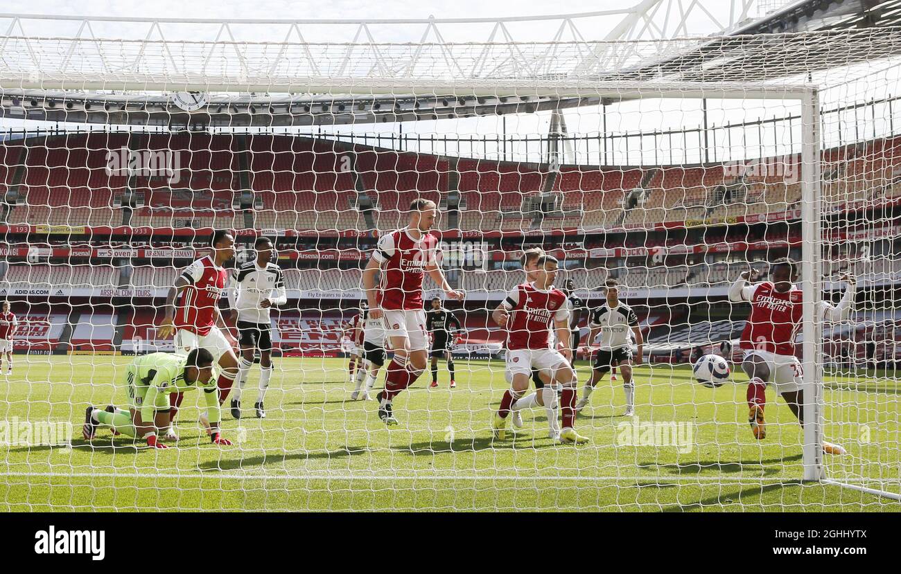 London, England, 18th April 2021. Eddie Nketiah of Arsenal (r) scores ...