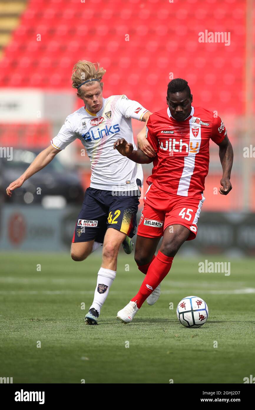 Monza, , 4th May 2021. Morten Hjulmand of US Lecce tussles with Mario ...