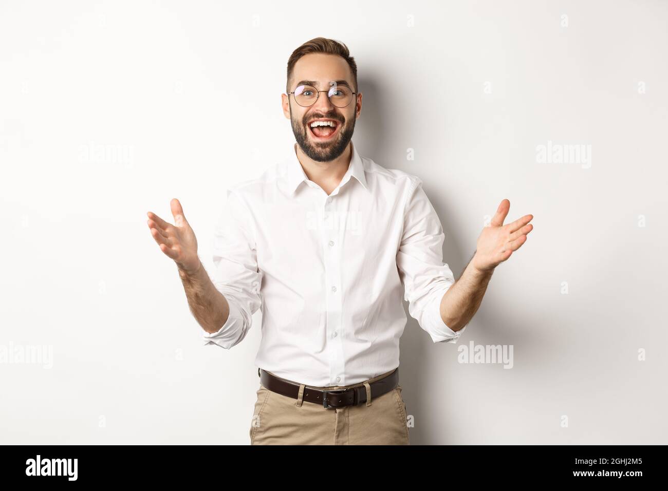 Surprised and happy businessman welcome you, looking excited and ...