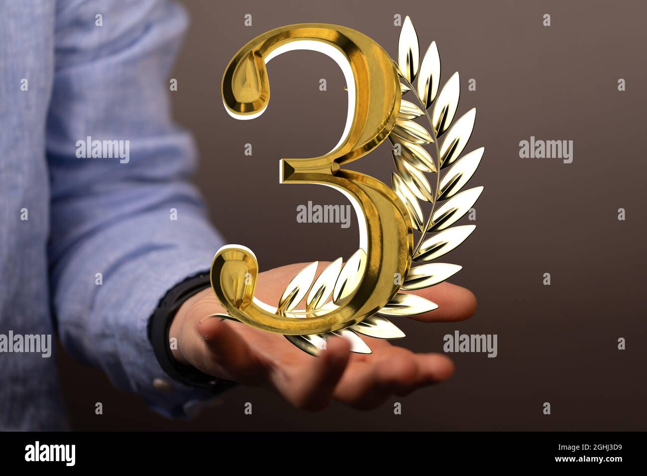 3d golden rendering of 3 with laurel wreath hovering over man's palm ...