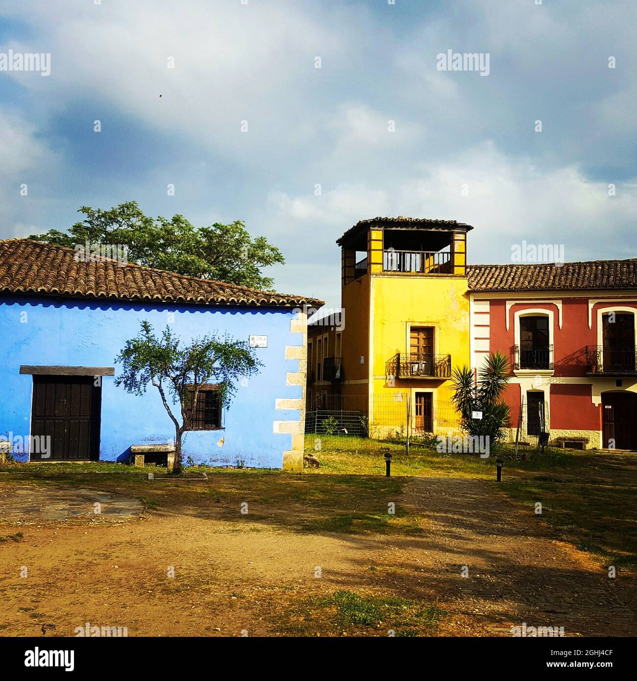 Plaza of the abandoned town of Granadilla, houses of various colors ...
