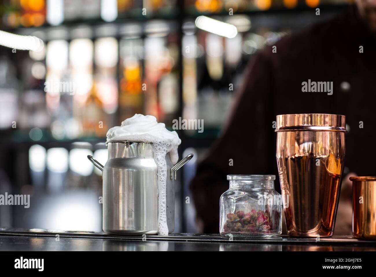 Milkshake with foam in metallic jar isolated on bar background Stock ...