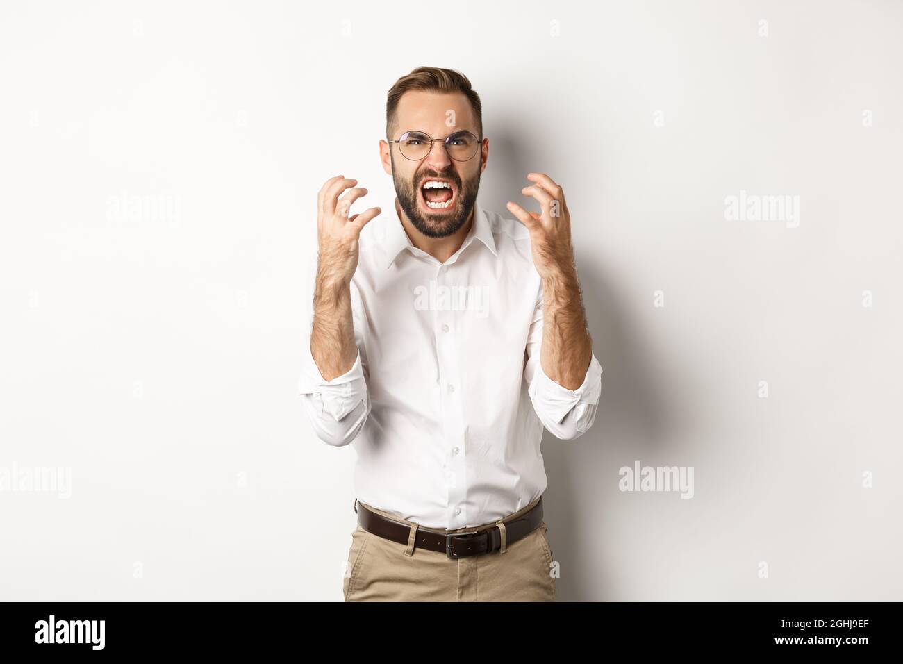 Frustrated and angry man screaming in rage, shaking hands furious ...