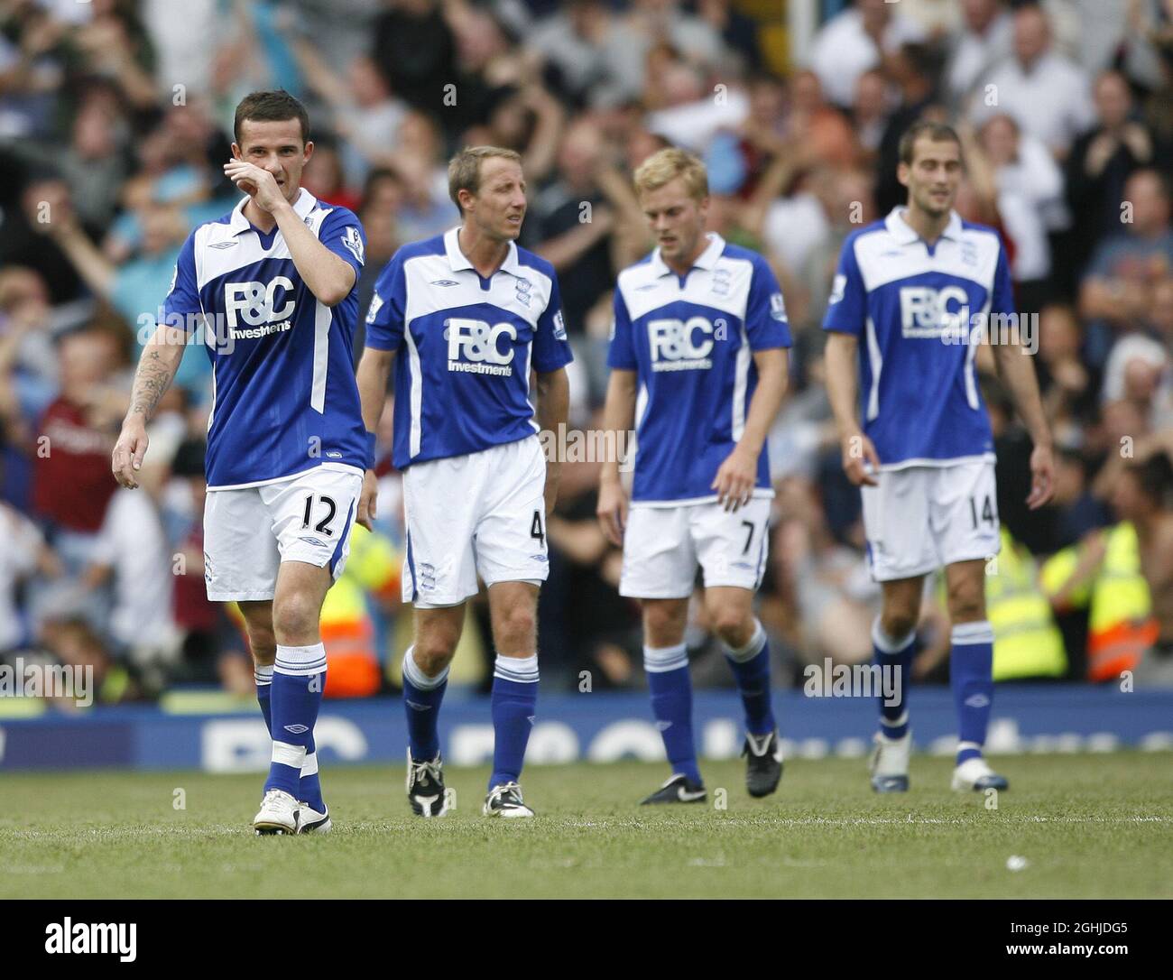 Birmingham's players look on dejected after going down 1-0 late during ...