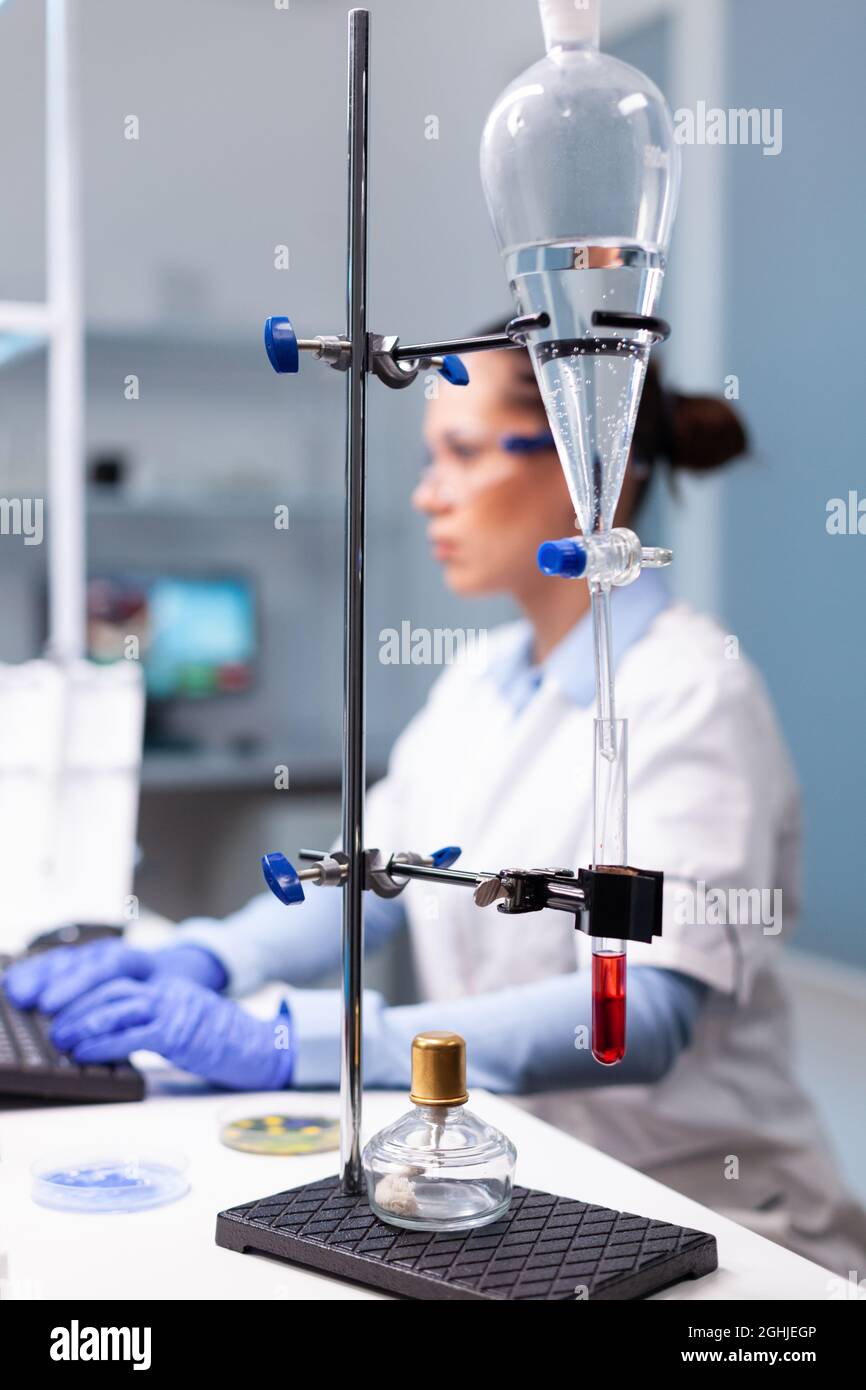 Specialist pharmacist woman typing bacteriology infection test results ...
