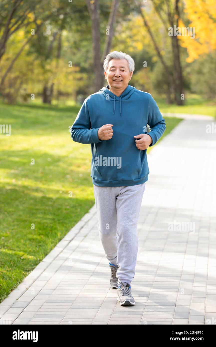 Senior chinese man jogging in hi-res stock photography and images - Alamy
