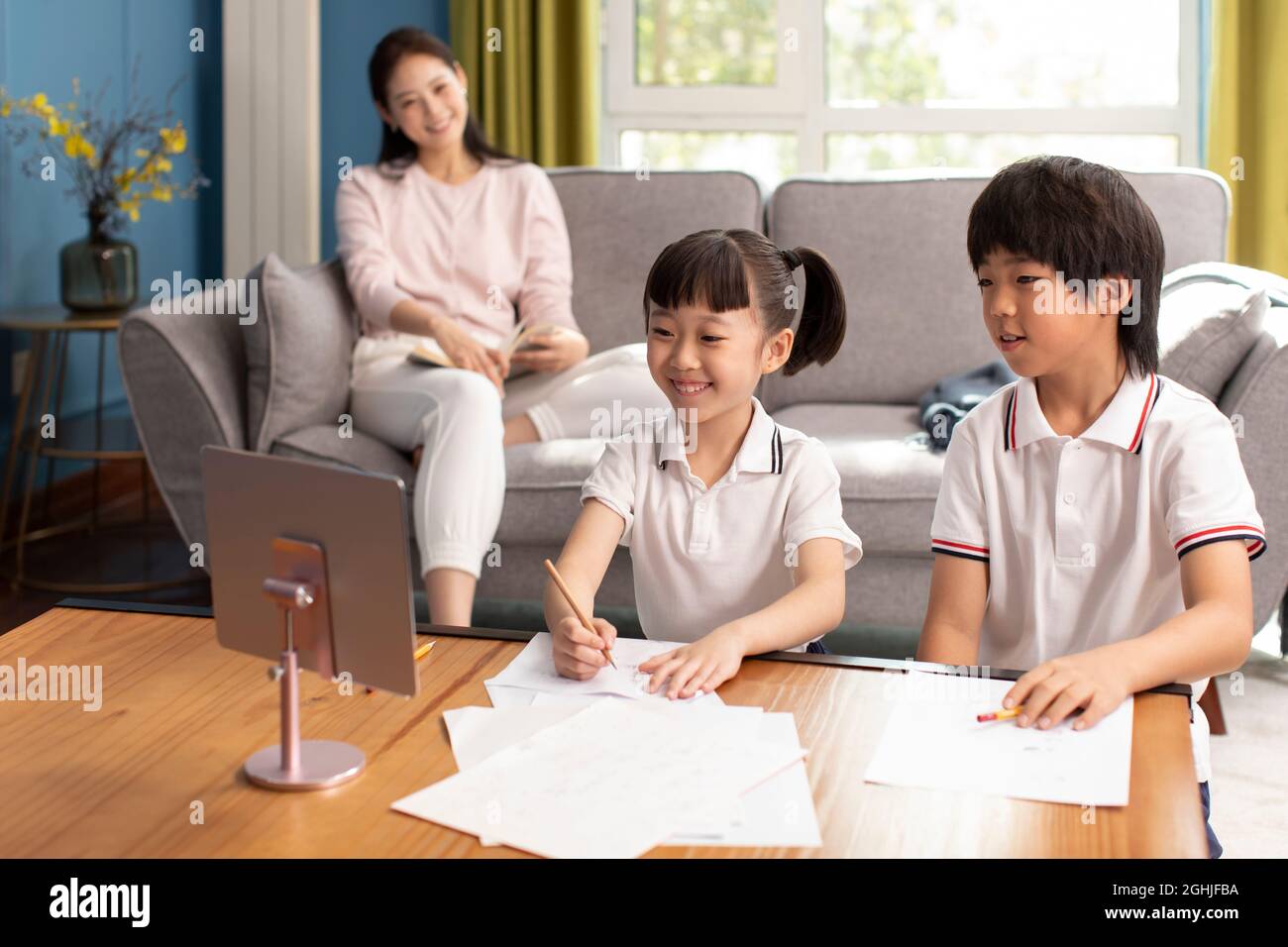 Cute children taking online courses at home Stock Photo - Alamy