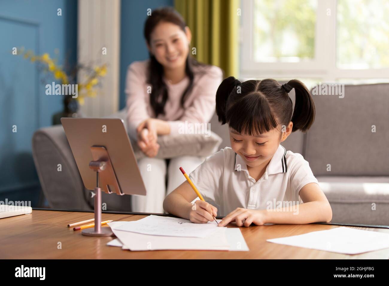 Cute girl taking online courses at home Stock Photo - Alamy