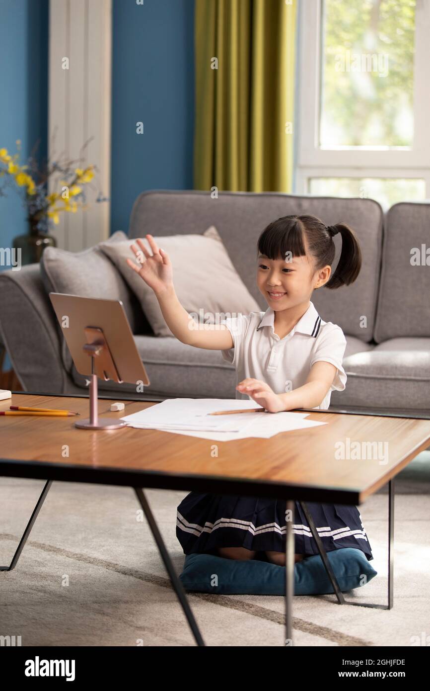 Cute girl taking online courses at home Stock Photo - Alamy