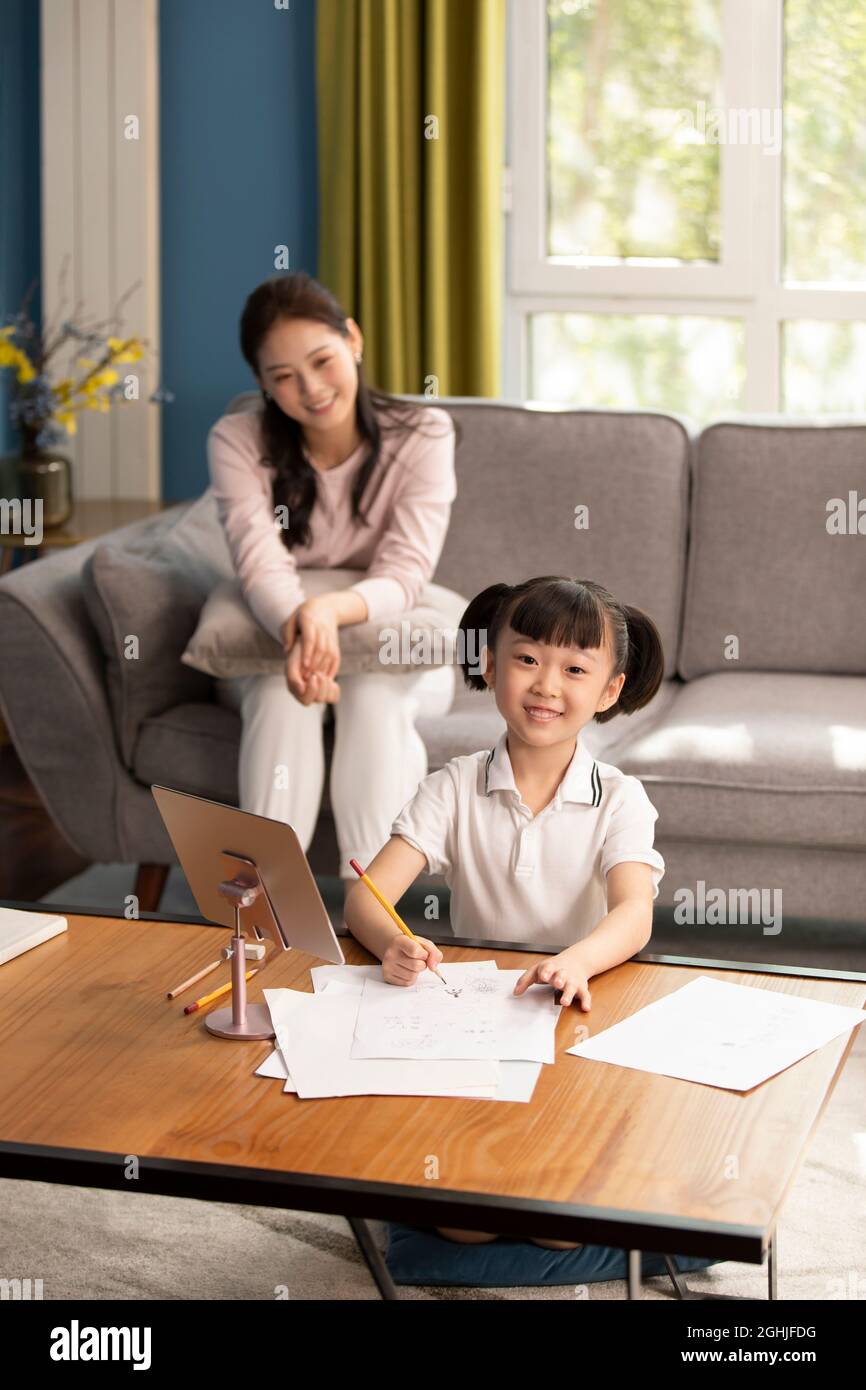 Cute girl taking online courses at home Stock Photo - Alamy