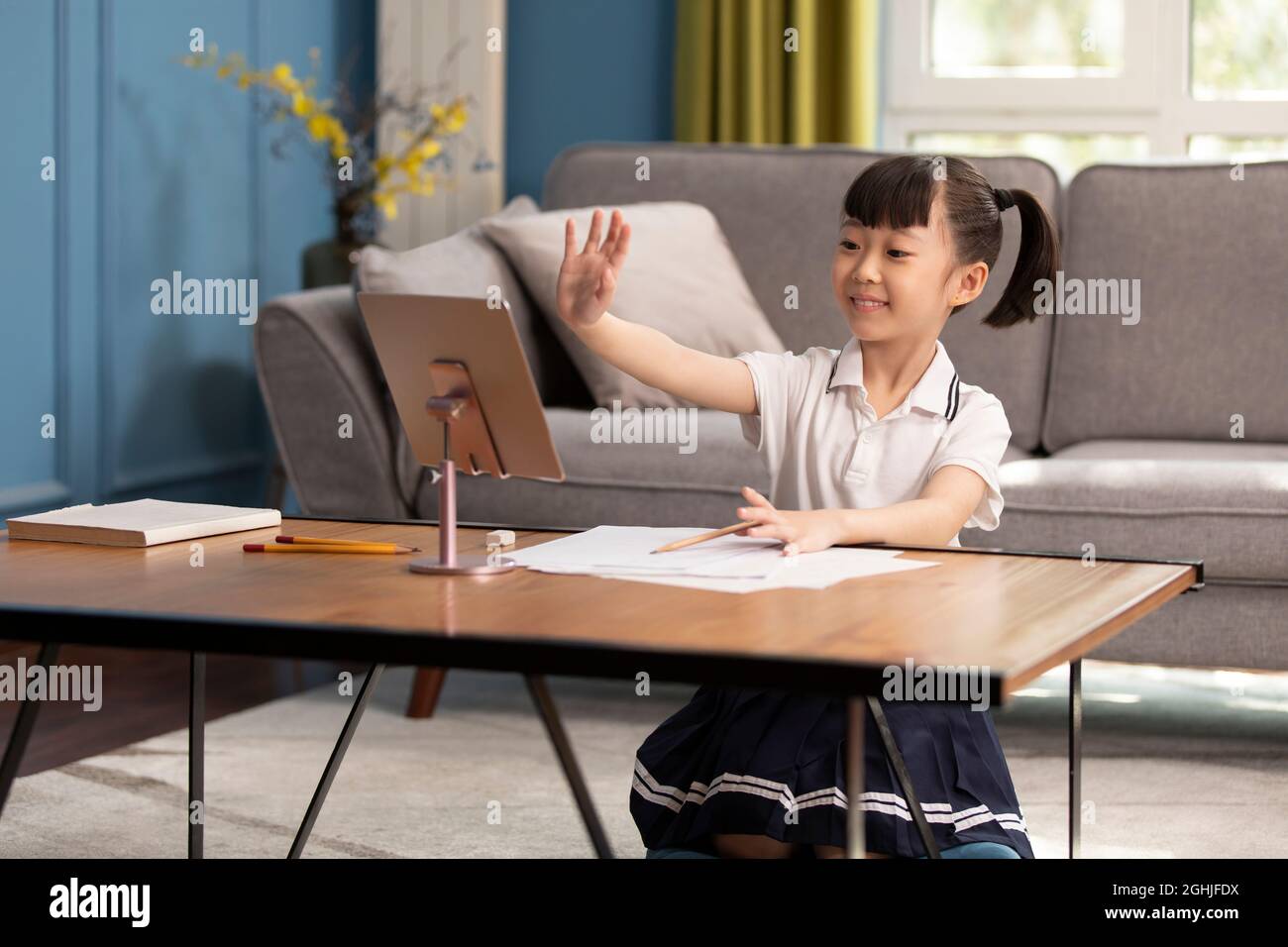 Cute girl taking online courses at home Stock Photo - Alamy