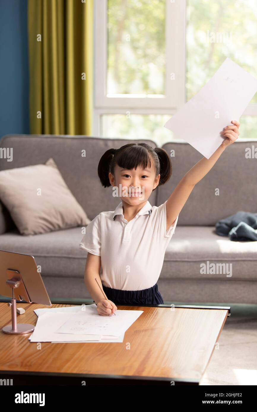 Cute girl taking online courses at home Stock Photo - Alamy