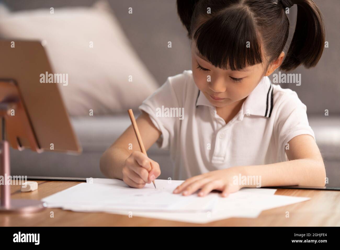 Cute girl taking online courses at home Stock Photo - Alamy