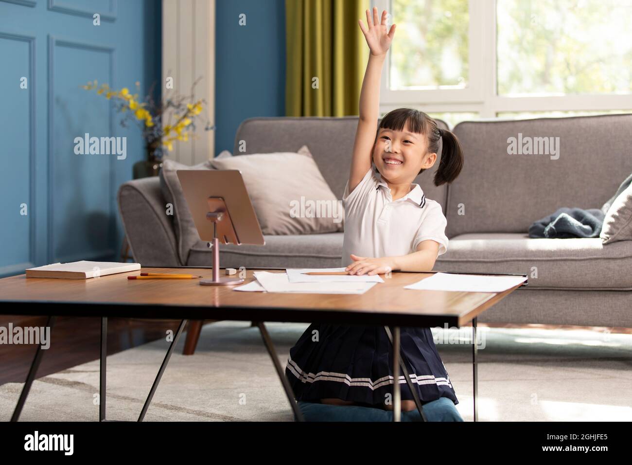 Cute girl taking online courses at home Stock Photo - Alamy