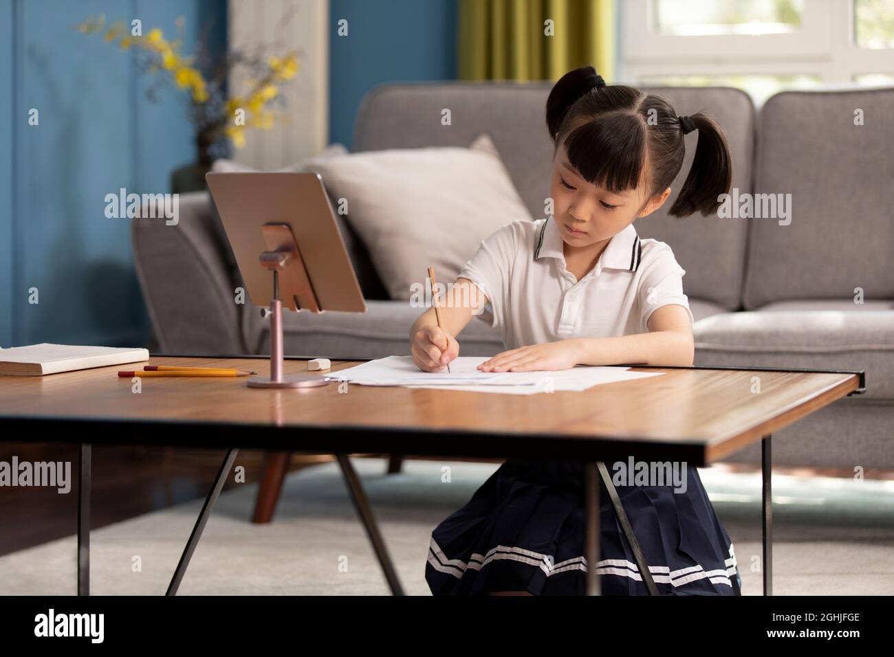 Cute girl taking online courses at home Stock Photo - Alamy