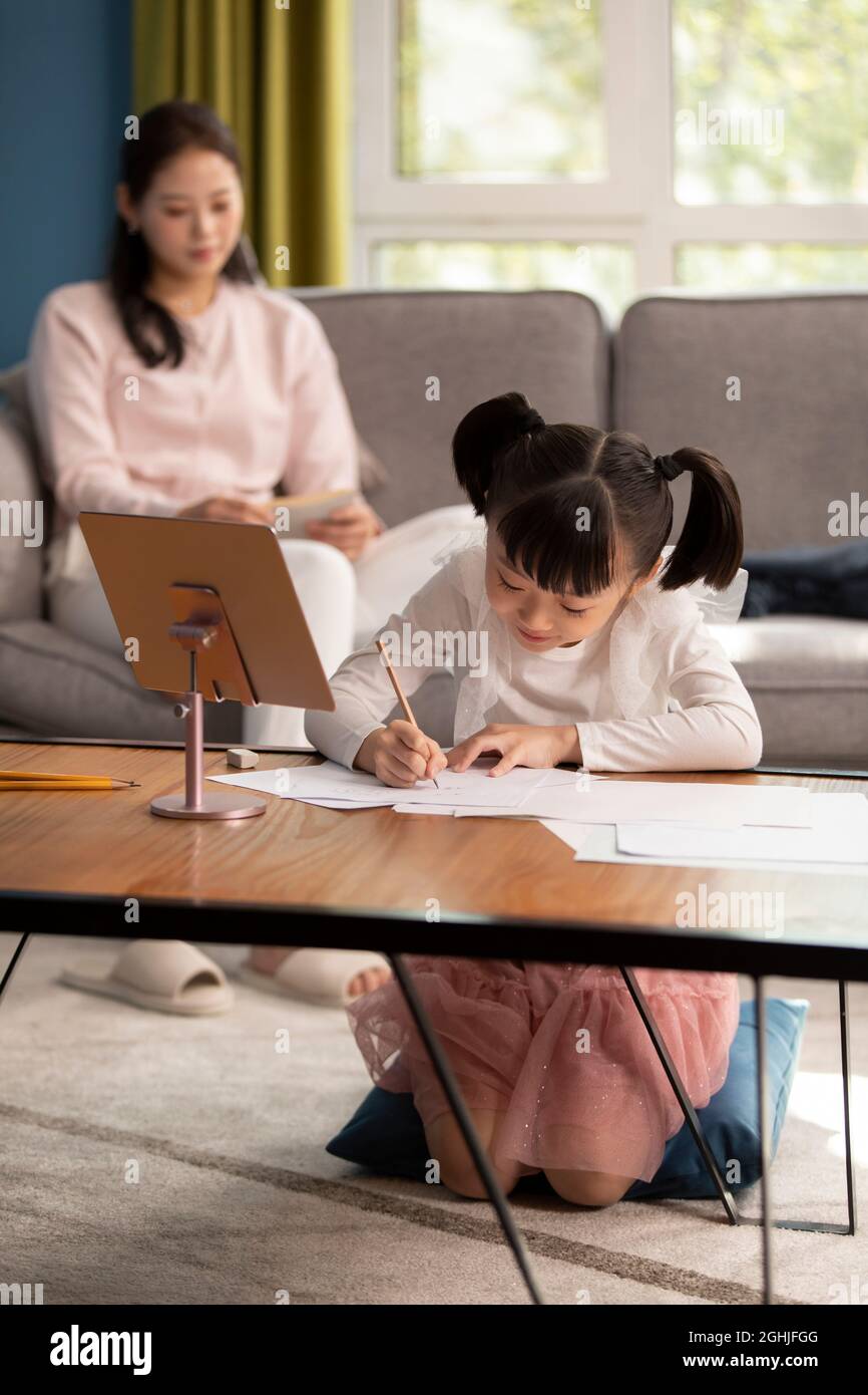 Cute girl taking online courses at home Stock Photo - Alamy