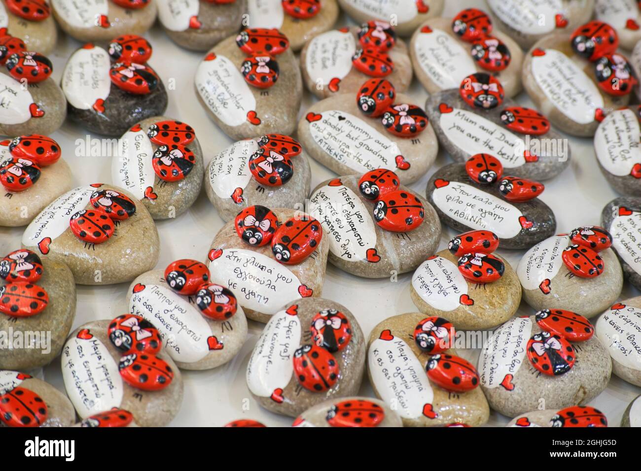 decorative stones, painted ladybugs with love messages Stock Photo - Alamy