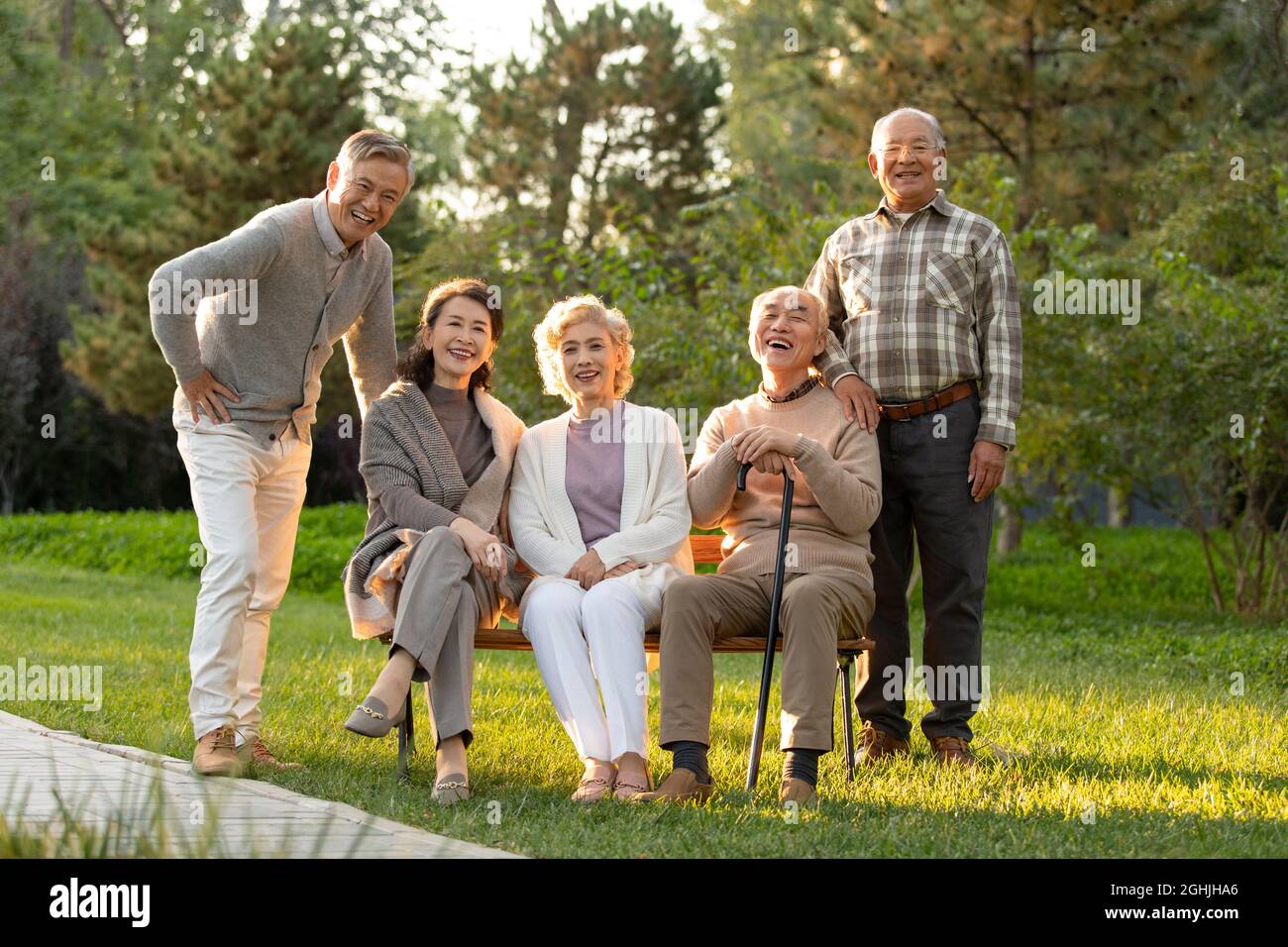 Cheerful senior adult relaxing in the park Stock Photo - Alamy