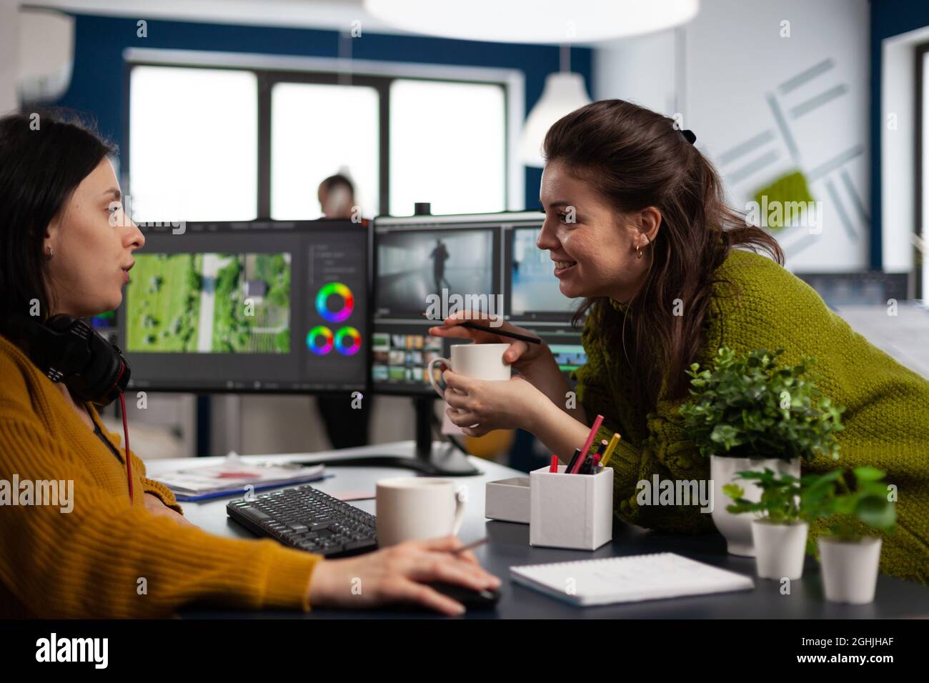 Videographer editing montage of film using modern software sharing ...