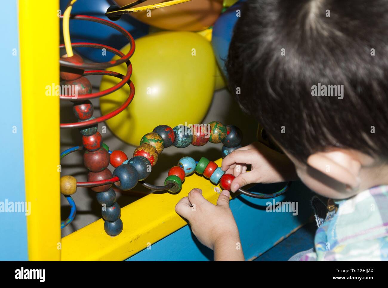 Child in colorful playground, birthday party Stock Photo - Alamy