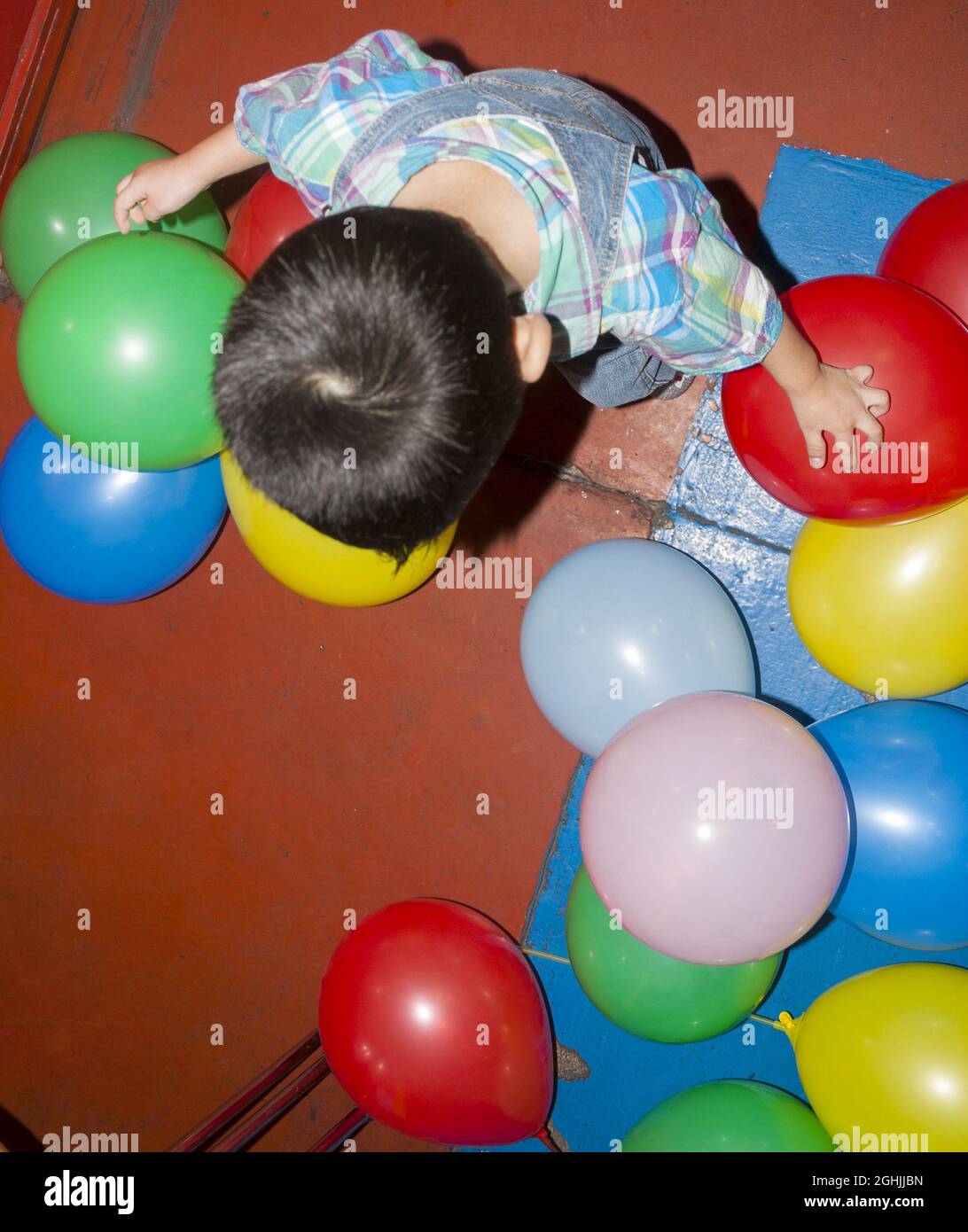 Child in colorful playground, birthday party Stock Photo - Alamy