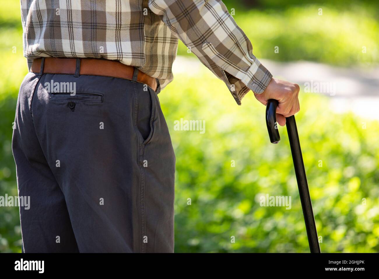 Senior man with a cane Stock Photo - Alamy