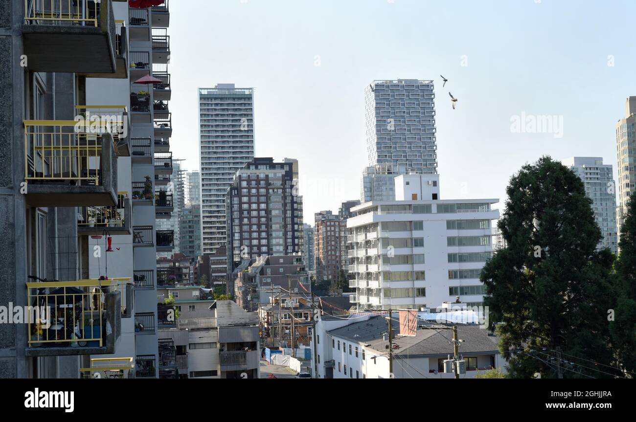 A view of apartment balconies (left) and apartment buildings and ...