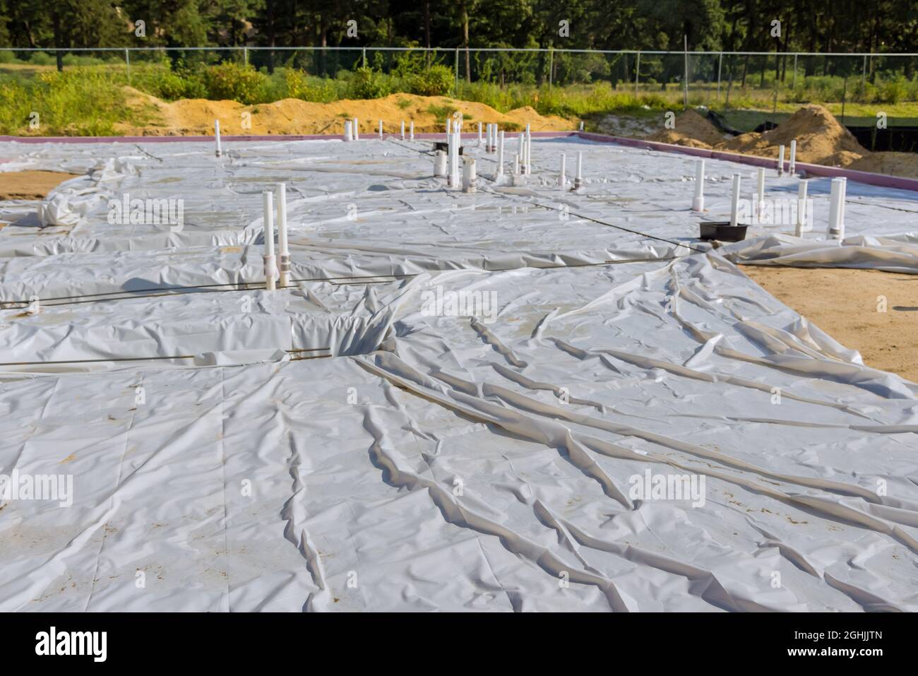 Rough pvc plumbing on slab of house foundation of sanitary pipes Stock ...