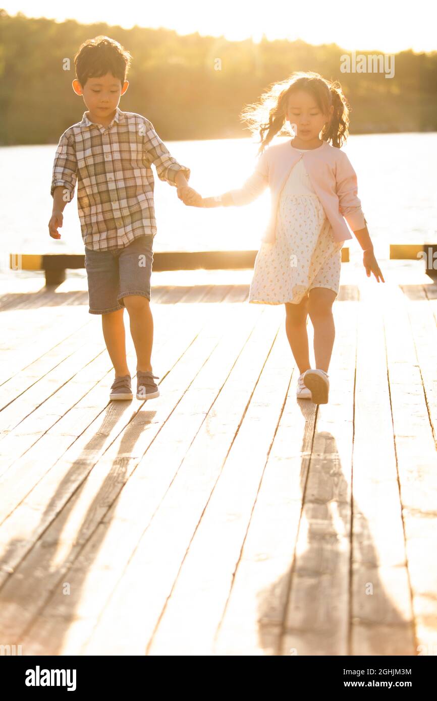 Happy children relaxing in park Stock Photo - Alamy