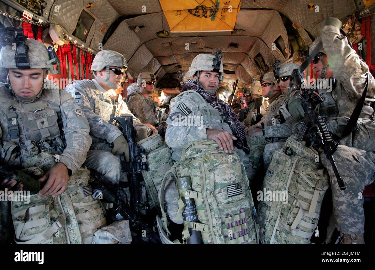 U.S. Army Soldiers prepare to conduct combat operations aboard a CH-47 ...